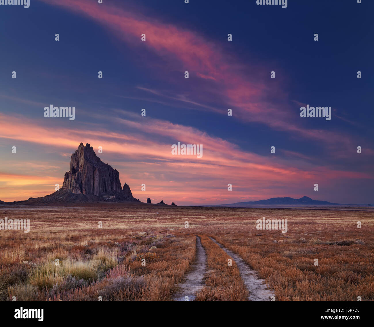 Shiprock, the great volcanic rock mountain in desert plane of New ...