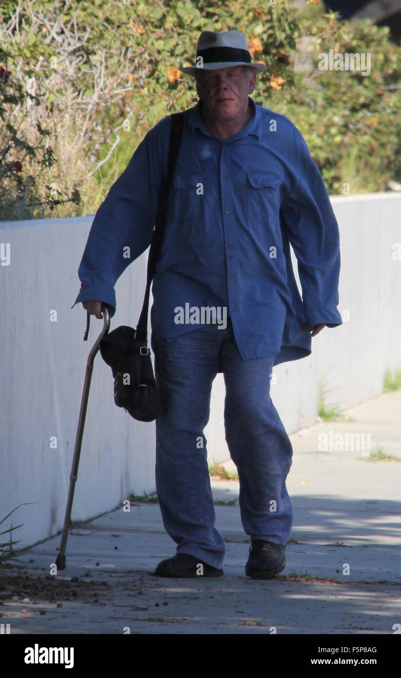 Nick Nolte walking with the aid of a walking stick while out and about ...