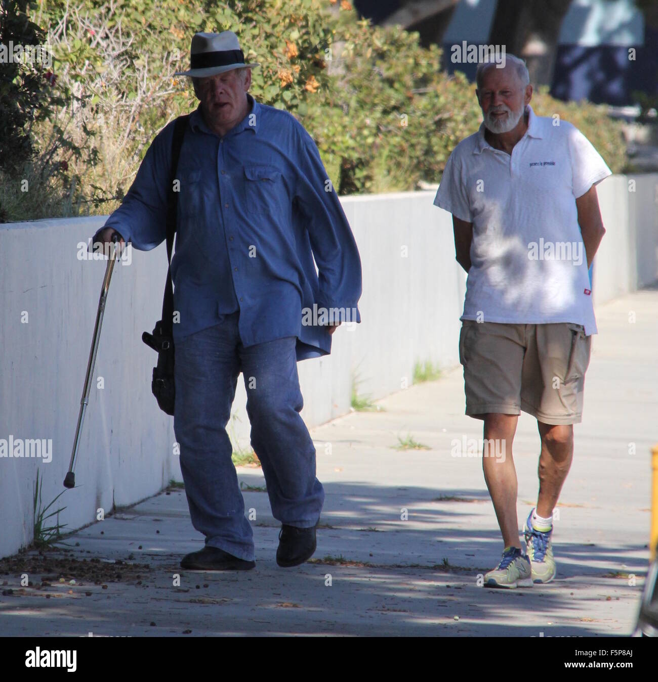 Nick Nolte walking with the aid of a walking stick while out and about ...