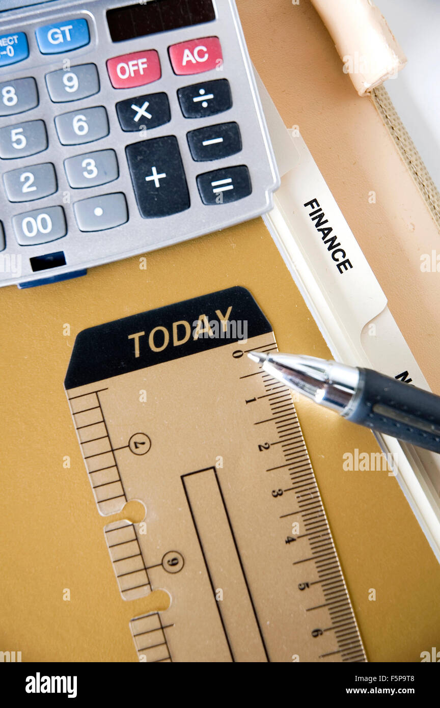 calculator and today tag put on finance page Stock Photo - Alamy