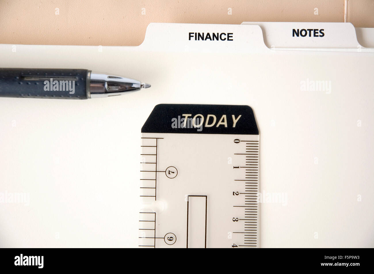 pen and today tag put on finance and notes page Stock Photo - Alamy