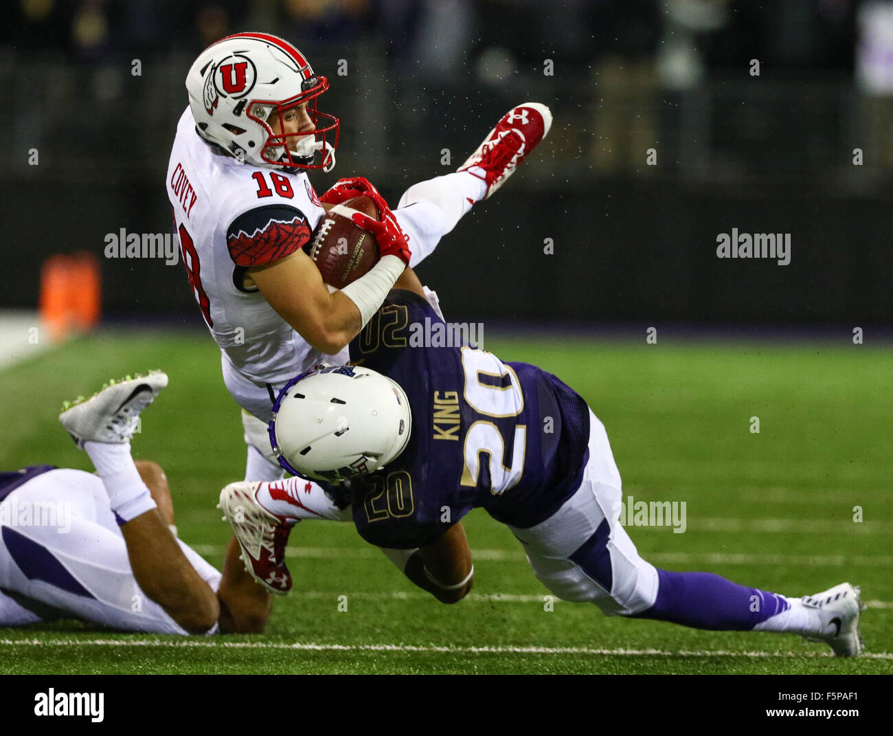 Seattle, USA. 07th Nov, 2015. Utah's Britain Covey (18) is wrapped up ...