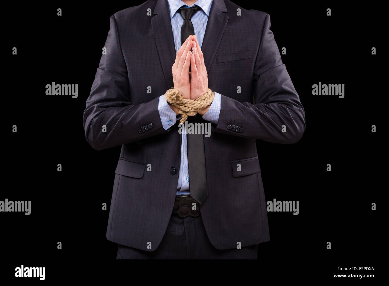 Businessmen tied hand Stock Photo - Alamy