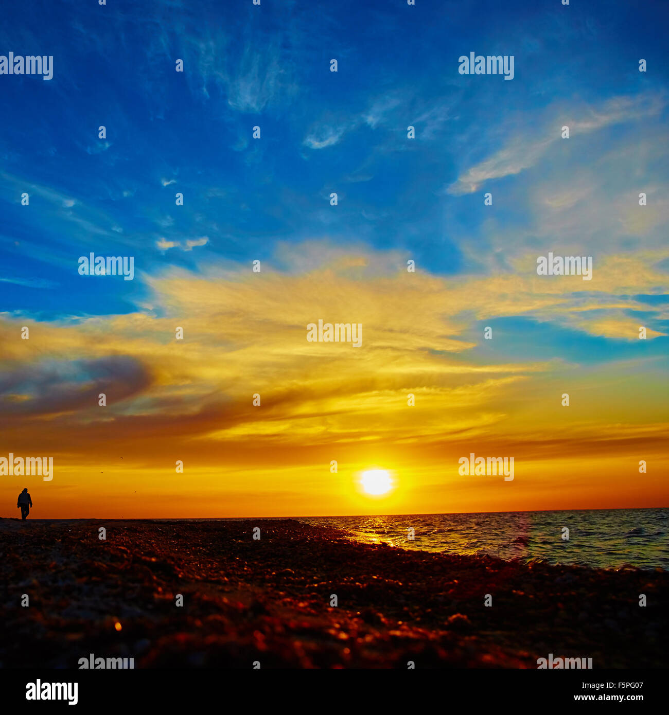 Sunset over the ocean Stock Photo - Alamy