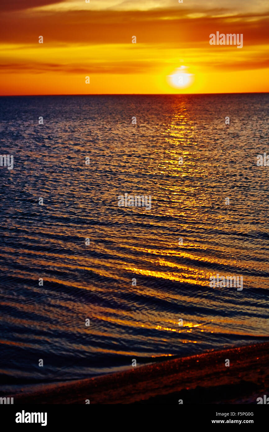 Sunset over the ocean Stock Photo - Alamy