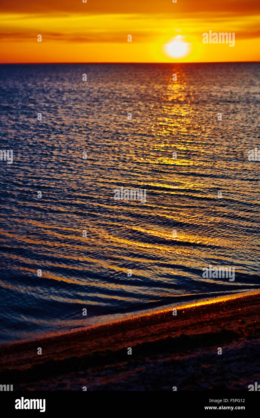 Sunset over the ocean Stock Photo - Alamy