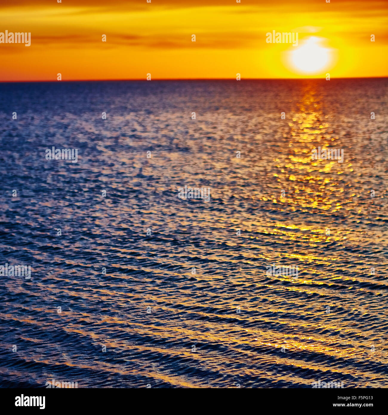 Sunset over the ocean Stock Photo - Alamy