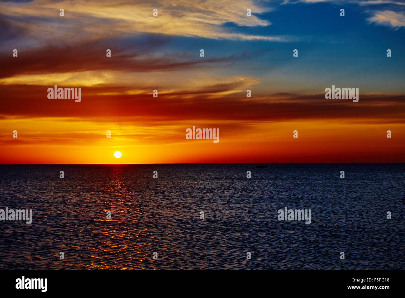 Sunset over the ocean Stock Photo - Alamy