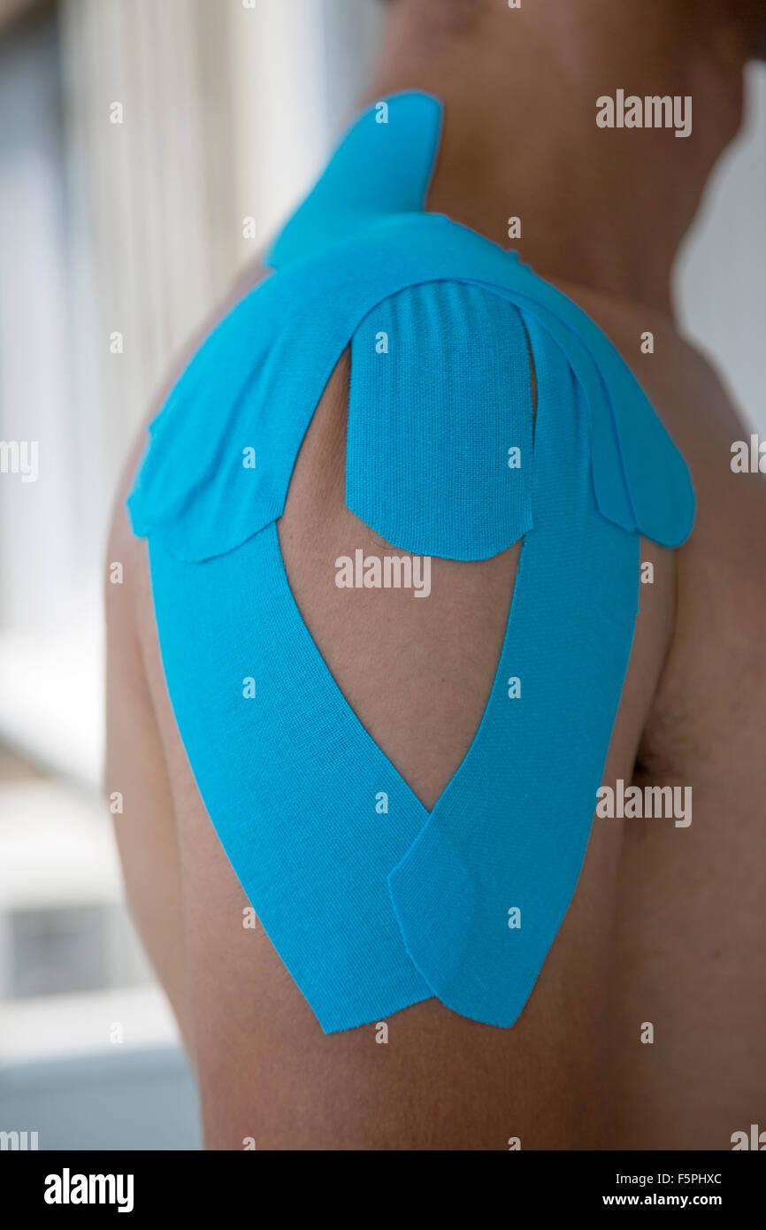 Adhesive bandage on shoulder Stock Photo - Alamy