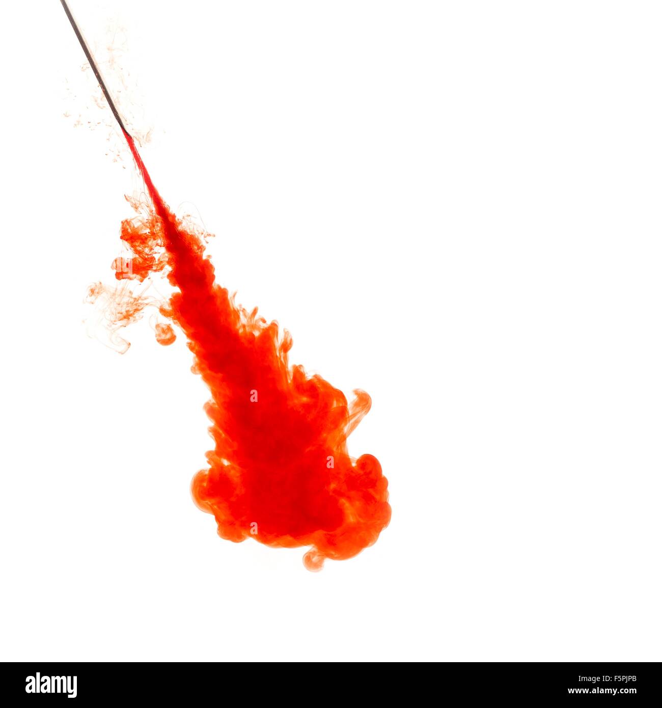 Red liquid against a white background Stock Photo - Alamy
