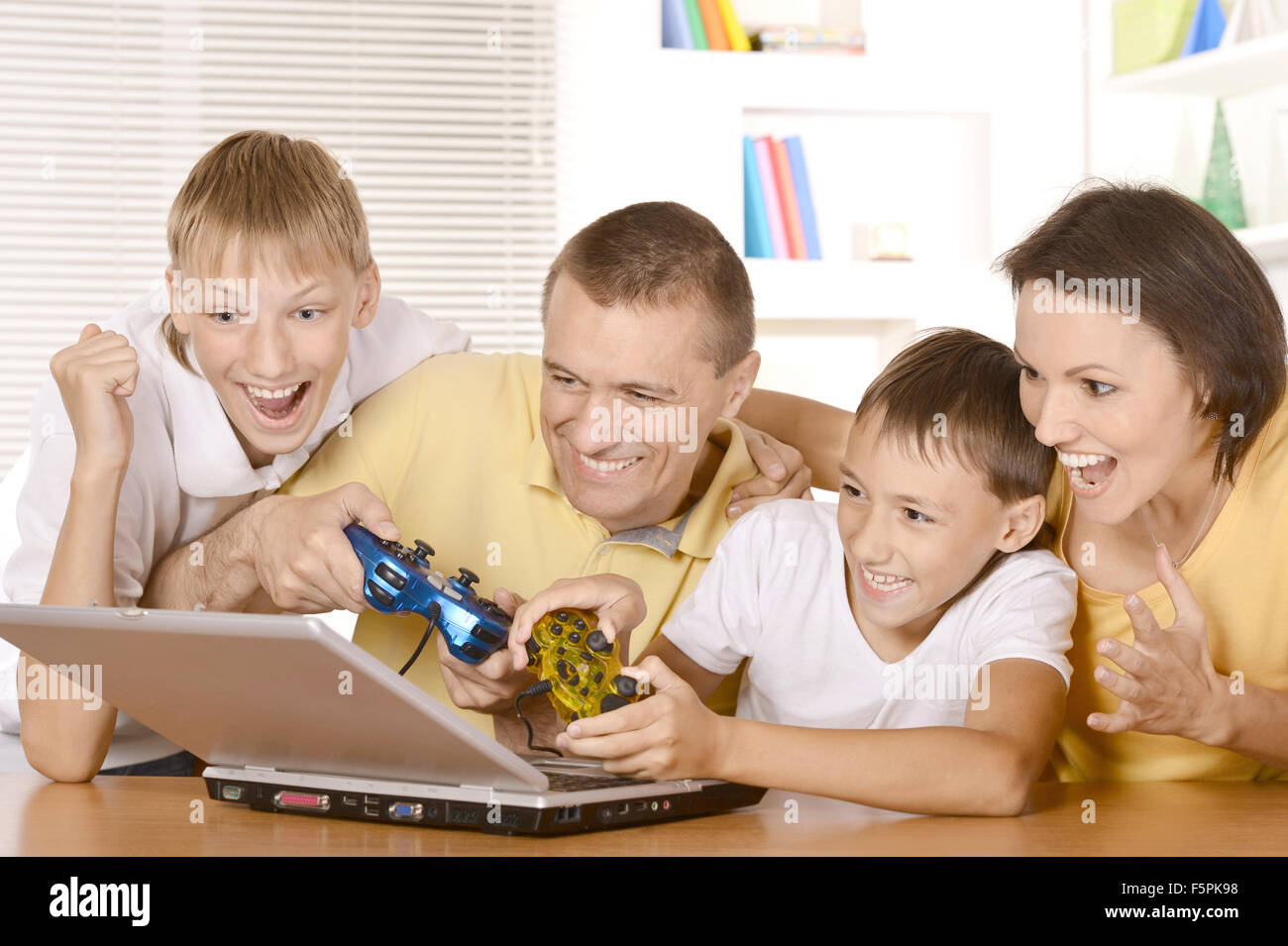 Children table sit laptop smile hi-res stock photography and images - Alamy