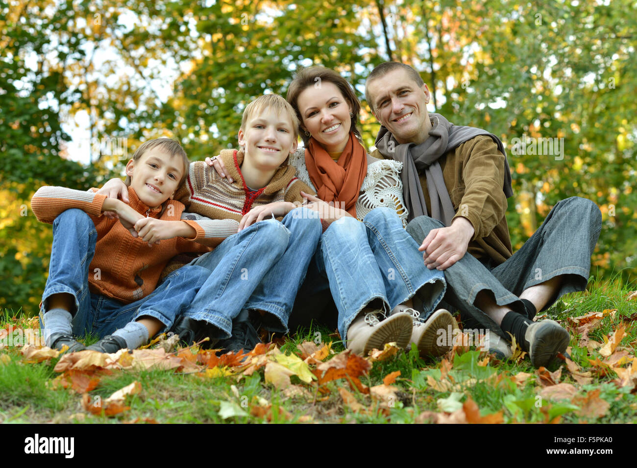 Portrait of family relaxing Stock Photo - Alamy