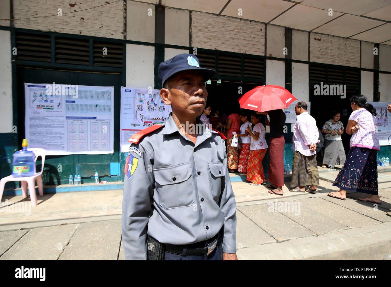 Yangon, Myanmar. 8th Nov, 2015. A specially recruited police officer ...