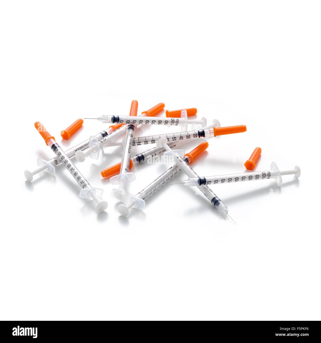 Syringes against a white background Stock Photo - Alamy
