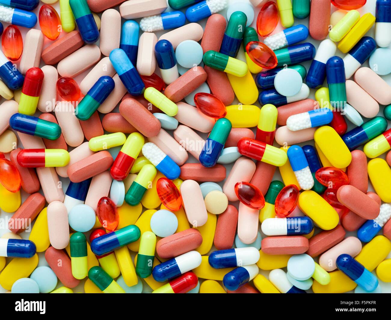 Coloured capsules and tablets, full frame Stock Photo - Alamy