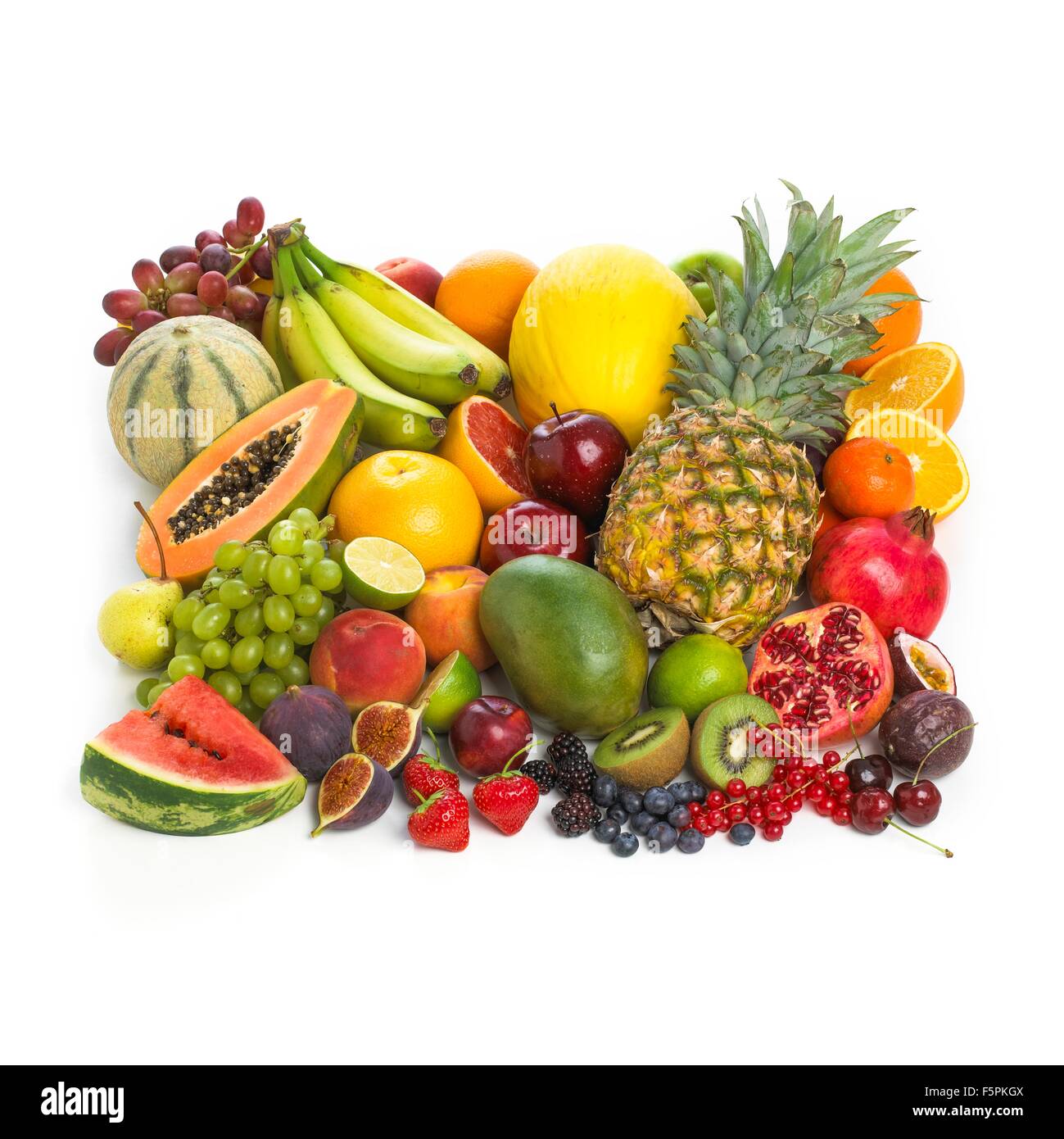 Selection of fresh fruit and vegetables against a white background ...