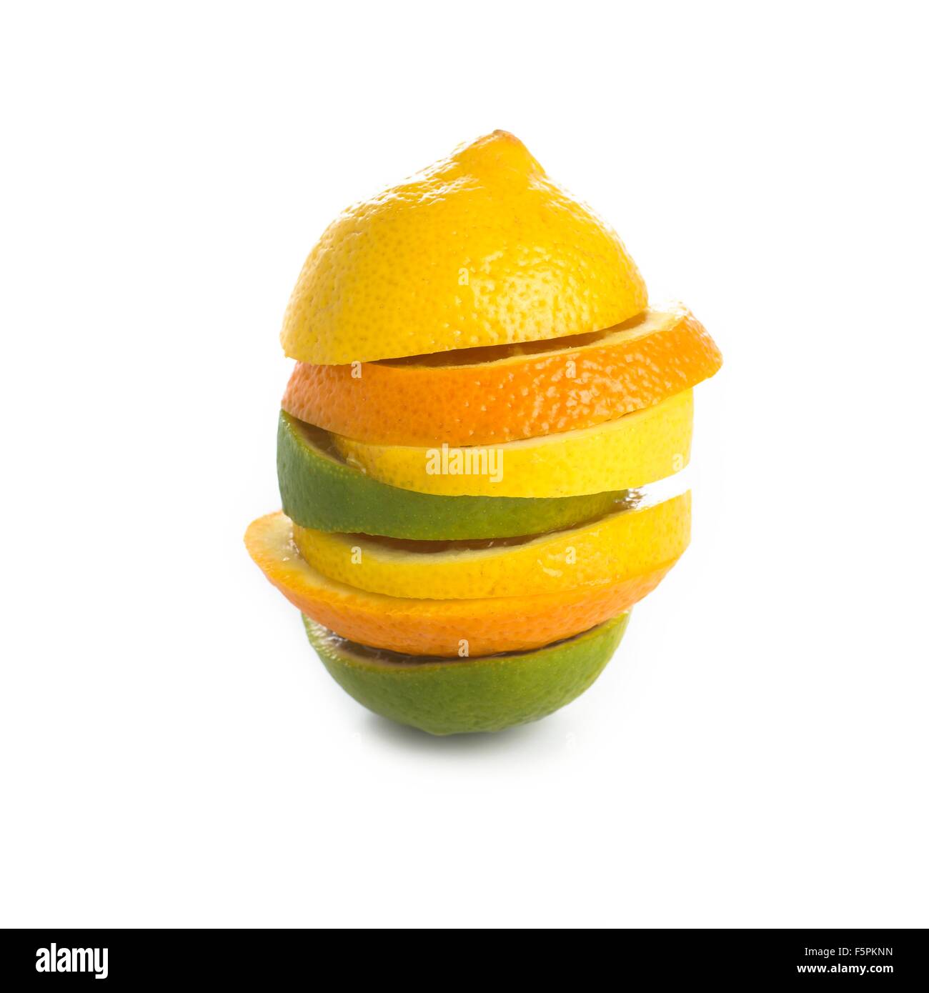 Citrus fruit slices in a stack against a white background Stock Photo ...