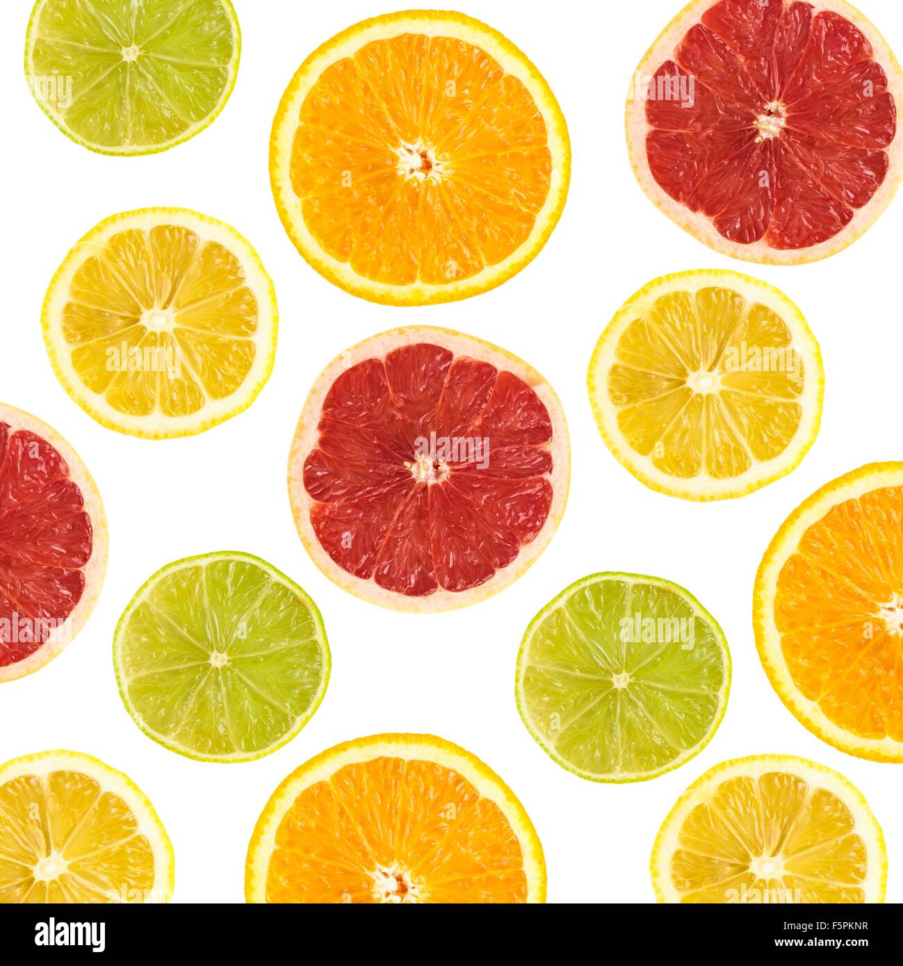 Citrus fruit slices against a white background Stock Photo - Alamy