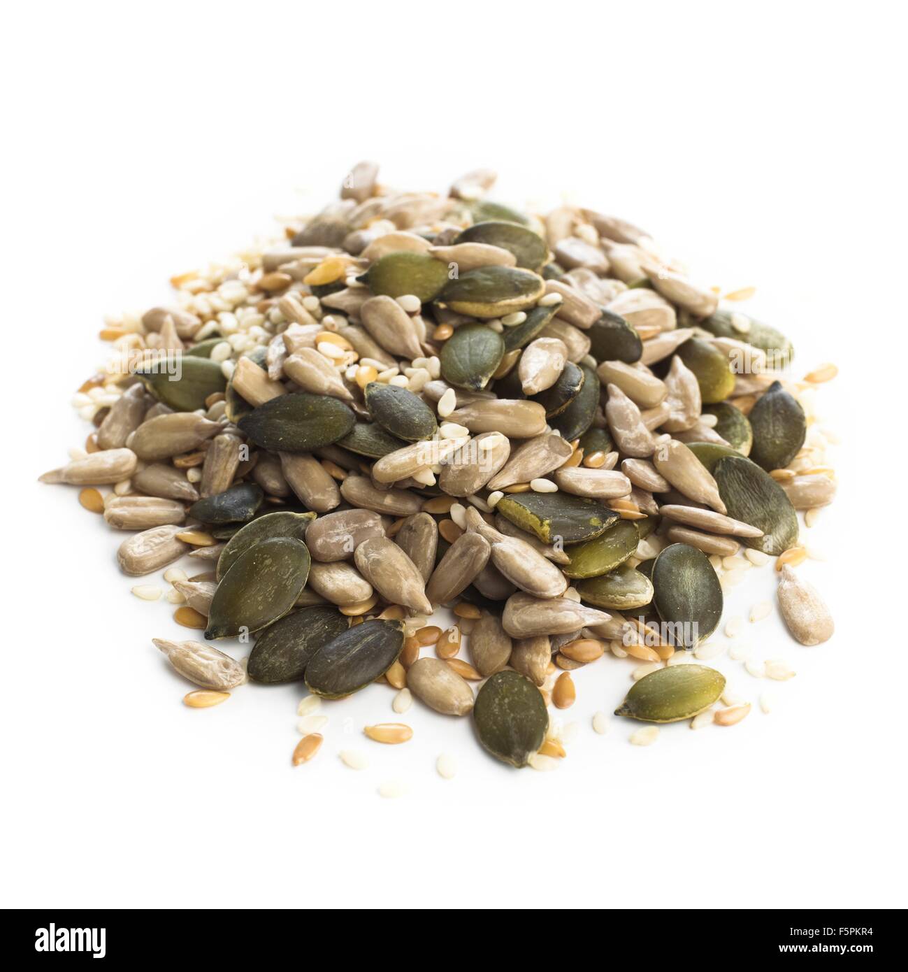 Various seeds against a white background Stock Photo - Alamy