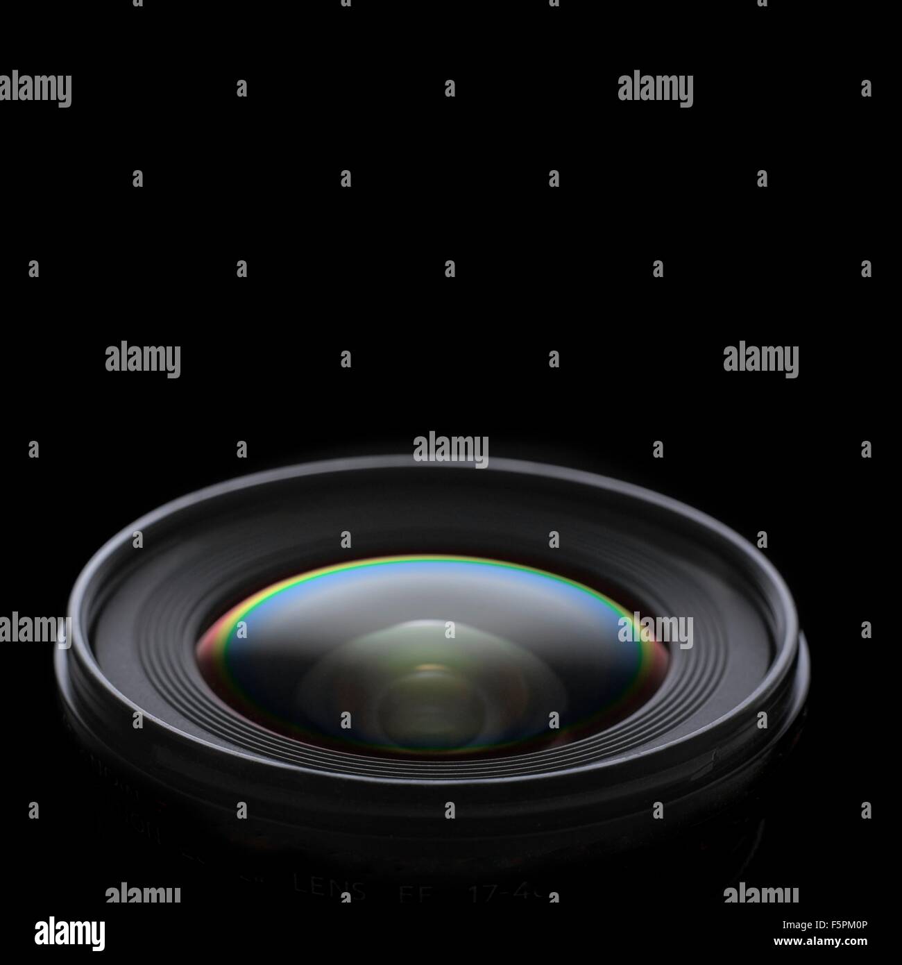 Camera lens against a black background Stock Photo - Alamy