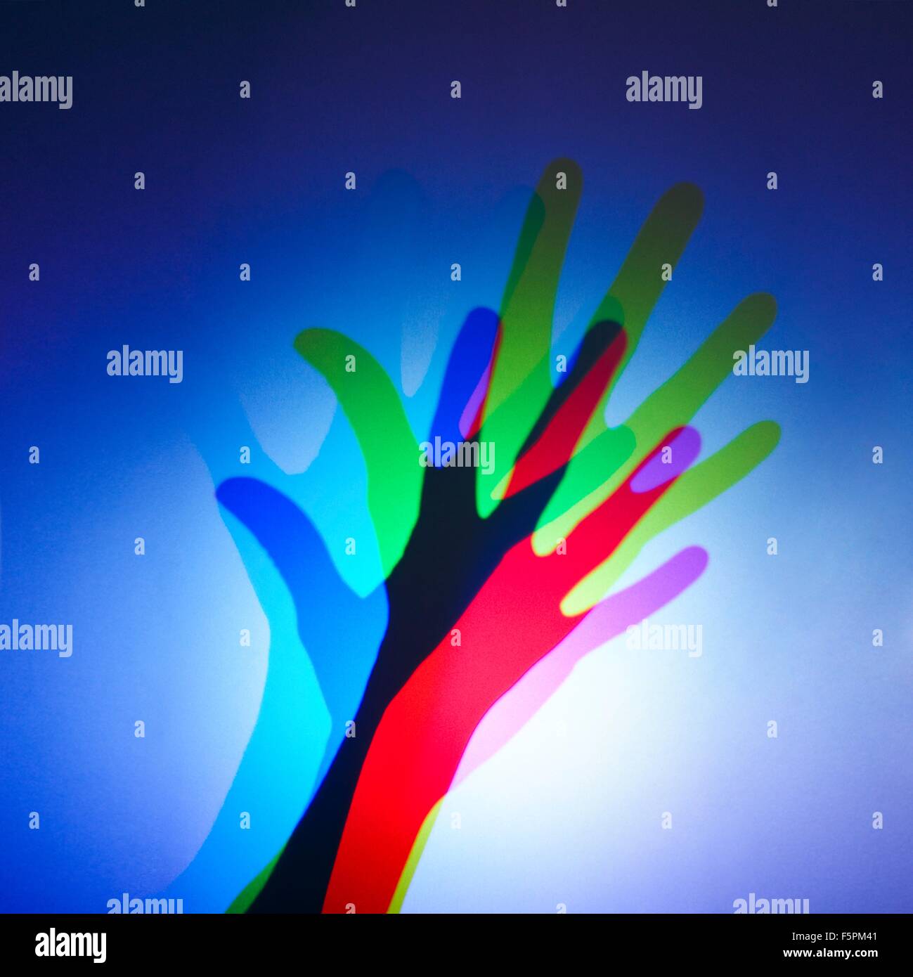Coloured lights shining onto a person's hand and mixing Stock Photo - Alamy