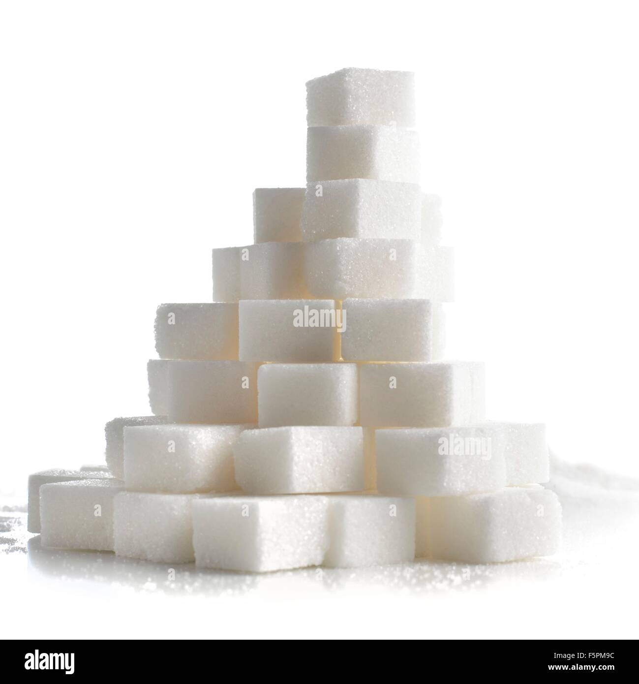 Sugar lumps against a white background Stock Photo - Alamy
