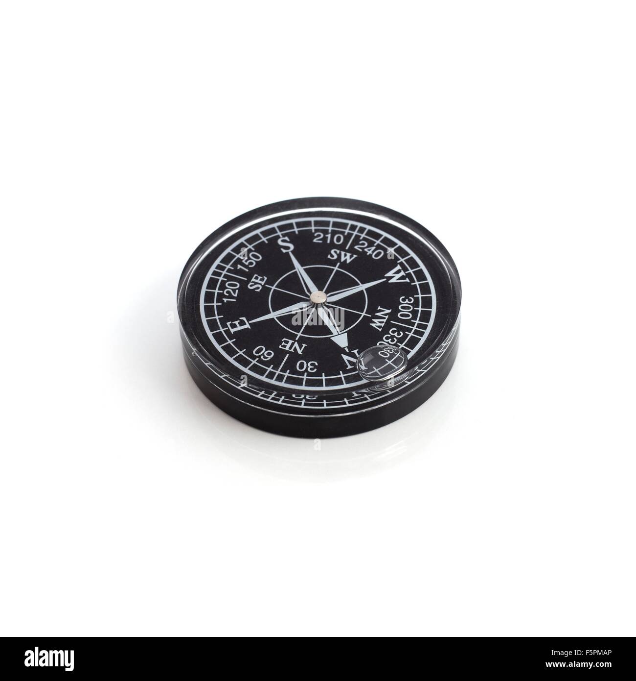 Compass against a white background Stock Photo - Alamy