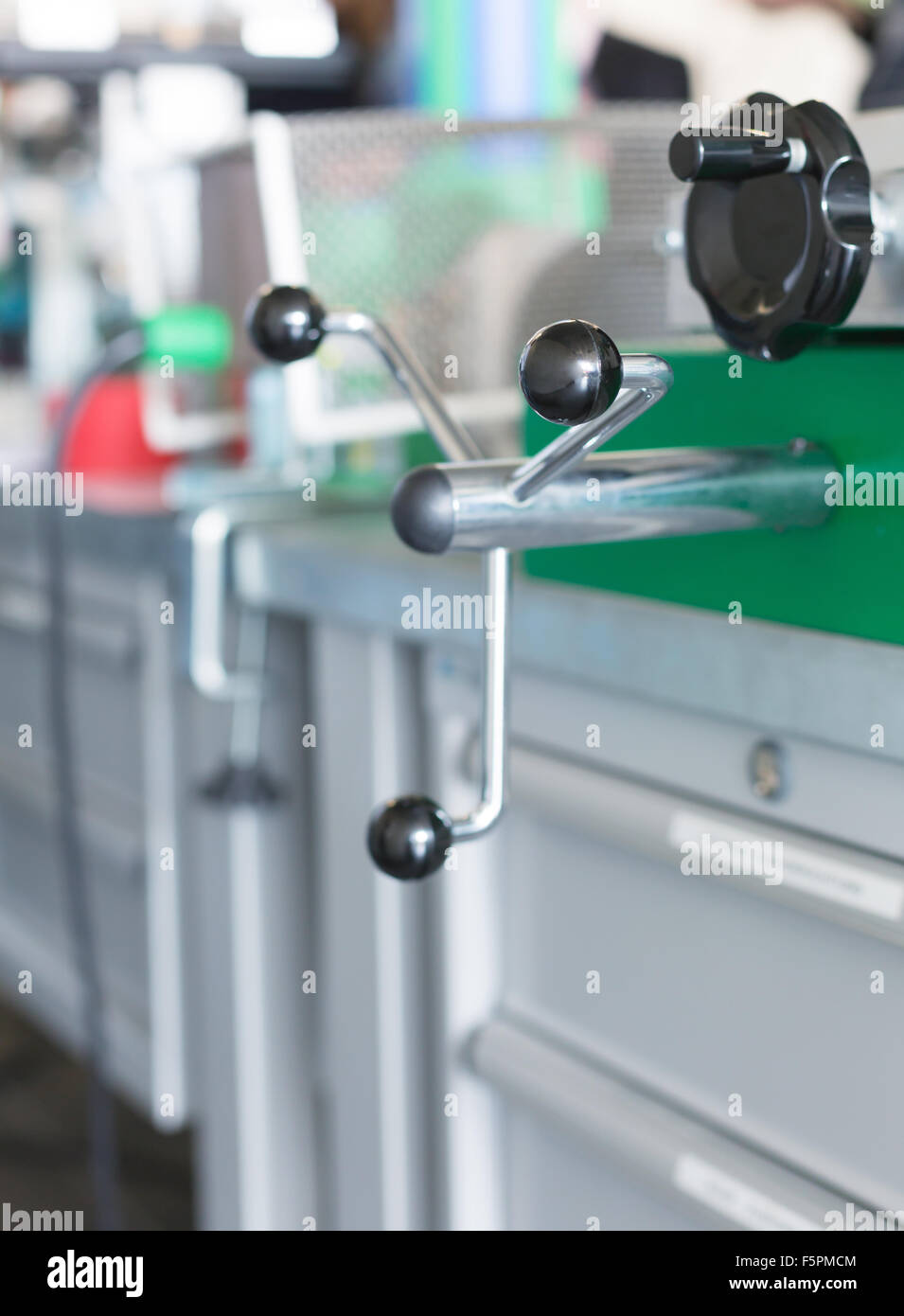 Lever of machine at workroom Stock Photo - Alamy