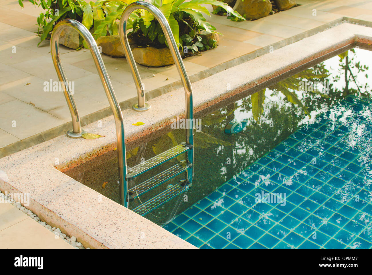clear blue swimming pool close up in tropical Stock Photo - Alamy