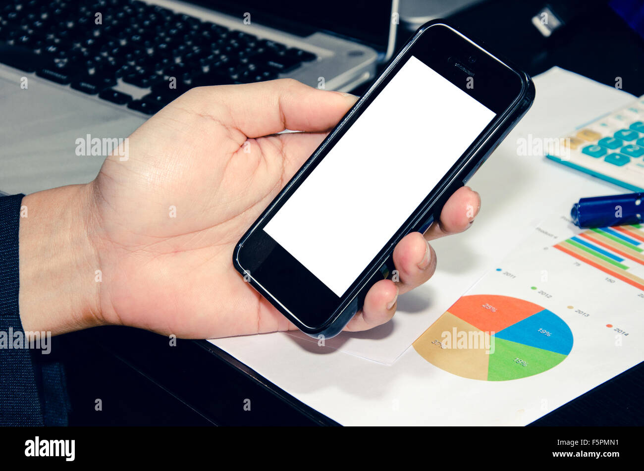 smart phone and chart on the table Stock Photo - Alamy