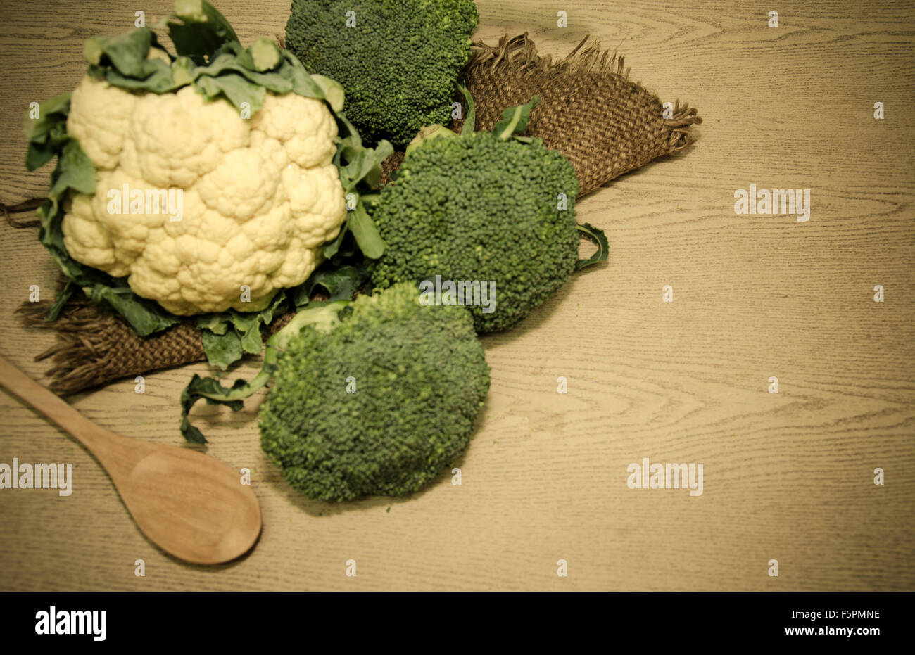 Cauliflower and broccoli on the wooden table Stock Photo - Alamy