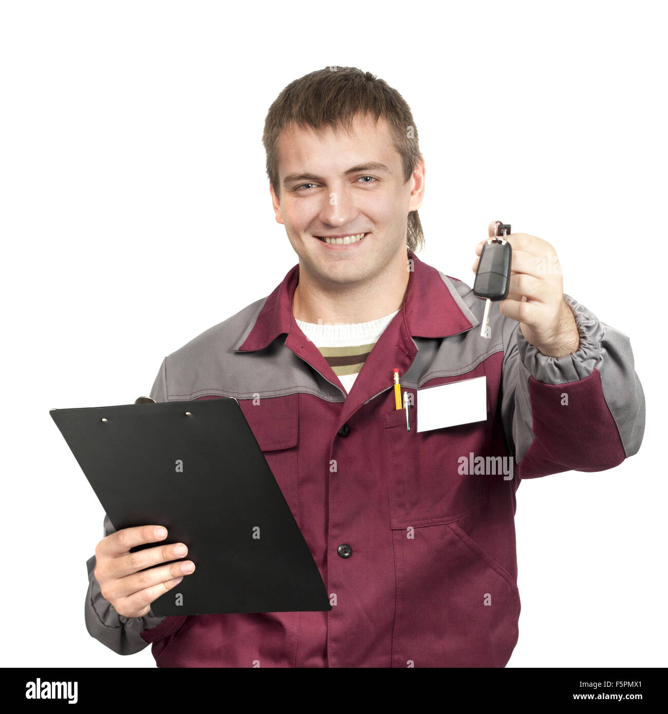 Mechanic with clipboard giving a car key. Isolated on white Stock Photo ...