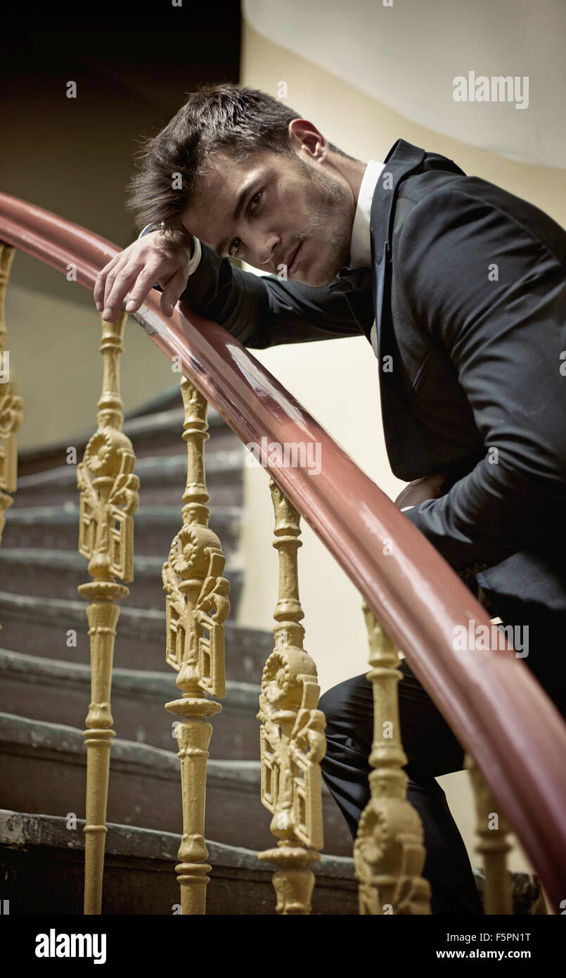 Man leaning on handrail hi-res stock photography and images - Alamy