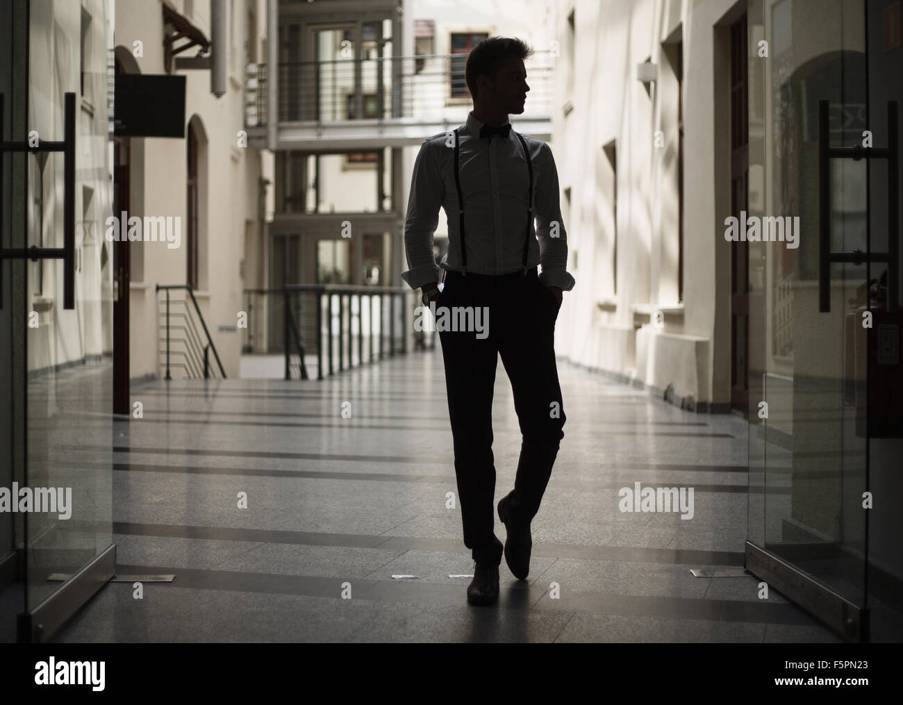 Smart man walking in the building Stock Photo - Alamy