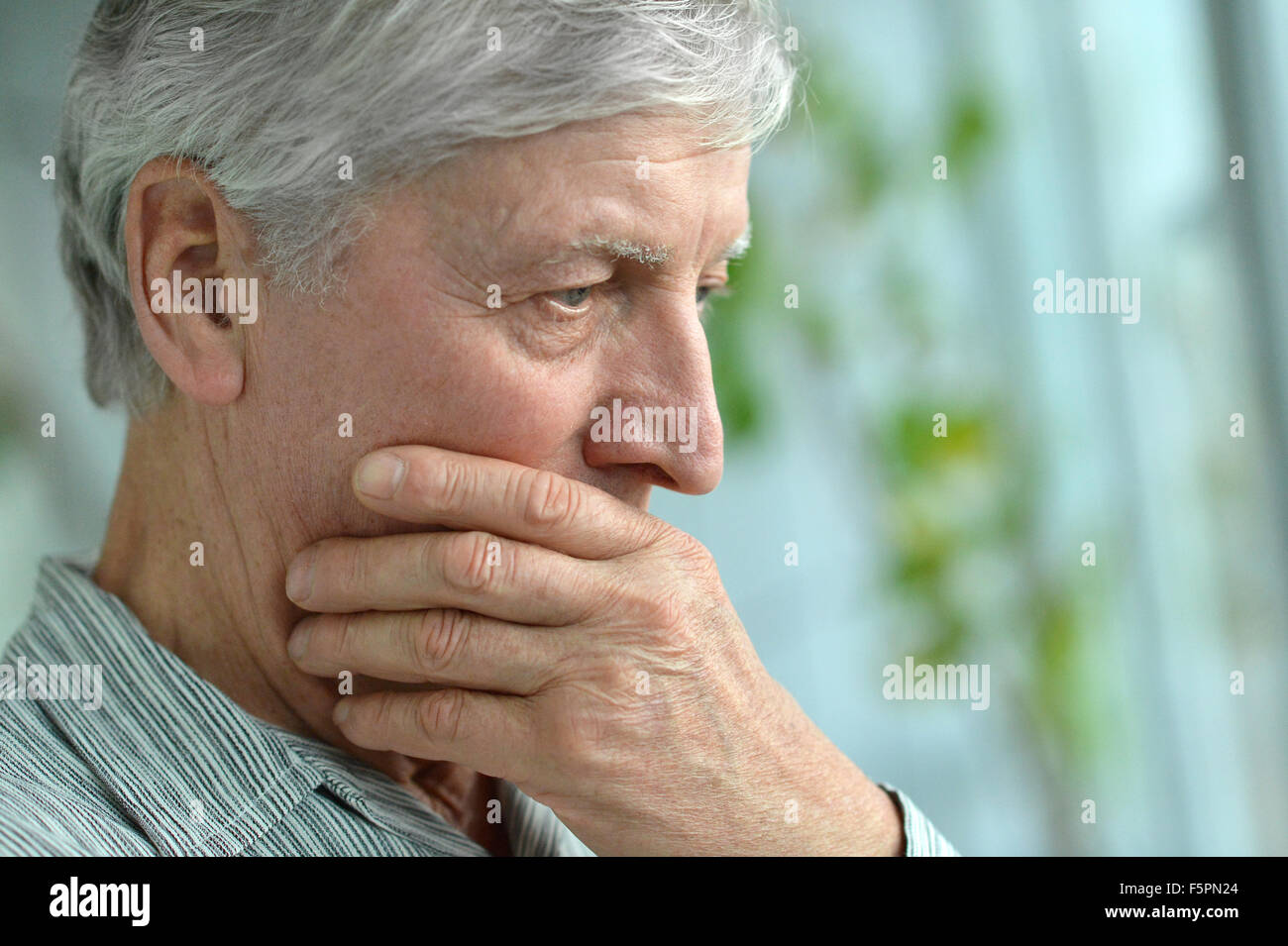 Sad senior man Stock Photo - Alamy