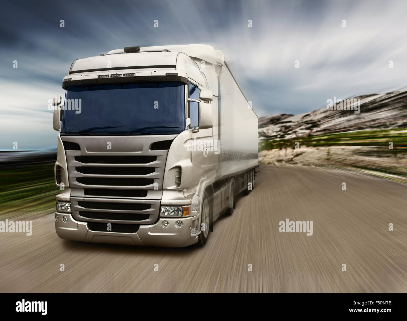 Gray truck on highway road Stock Photo - Alamy