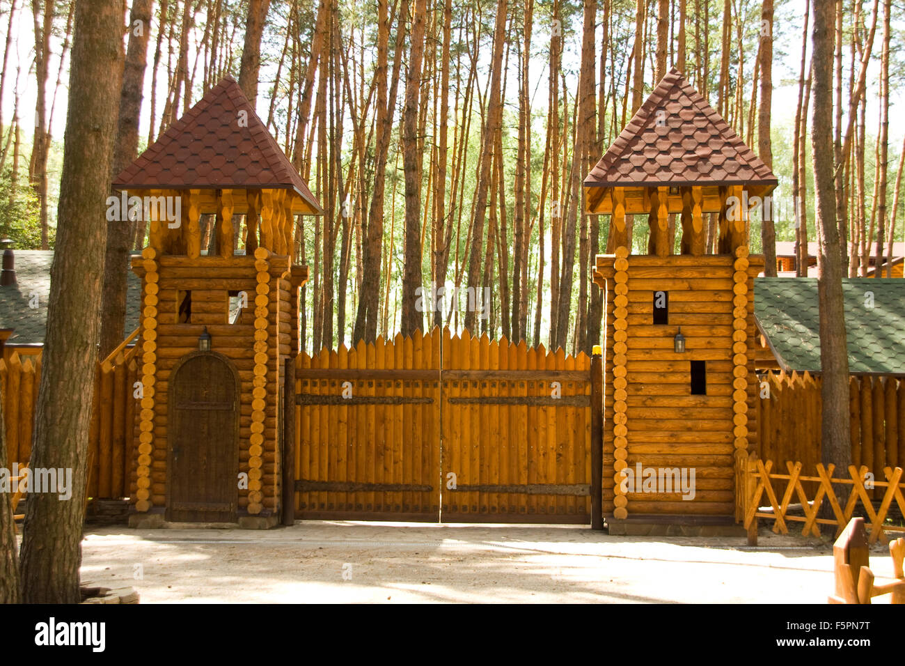 Big wood gates and two towers in forest Stock Photo - Alamy