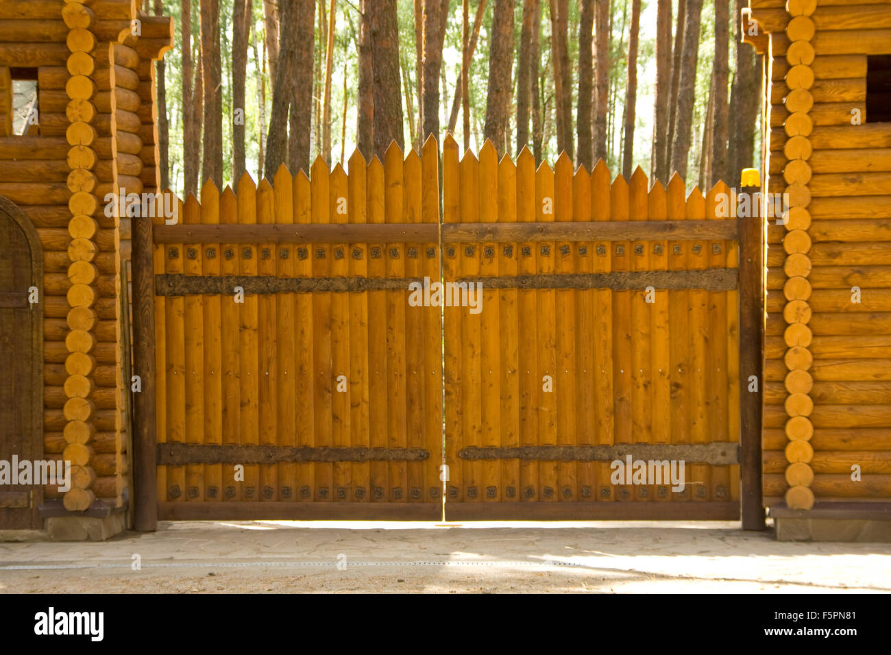 Big wood gates and two towers Stock Photo - Alamy