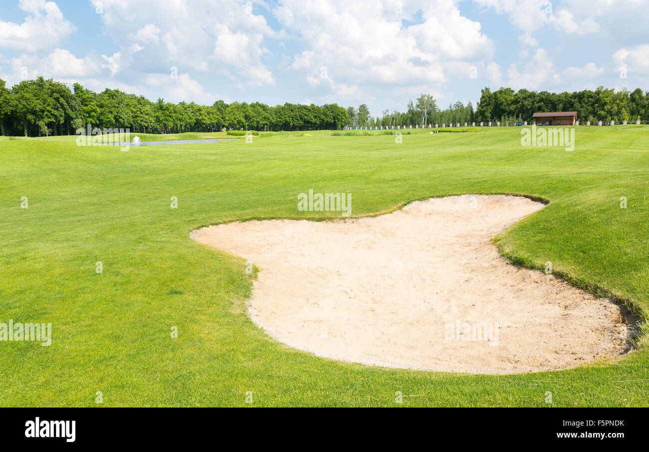 Golf field with sand zone on the meadow Stock Photo - Alamy