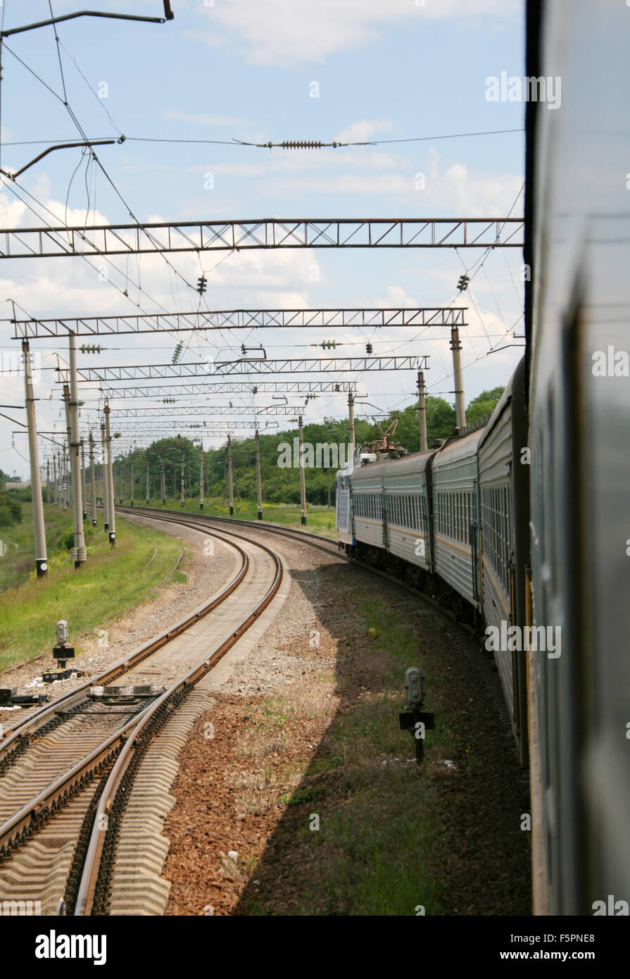 Passenger train and rail road. Perspective Stock Photo - Alamy