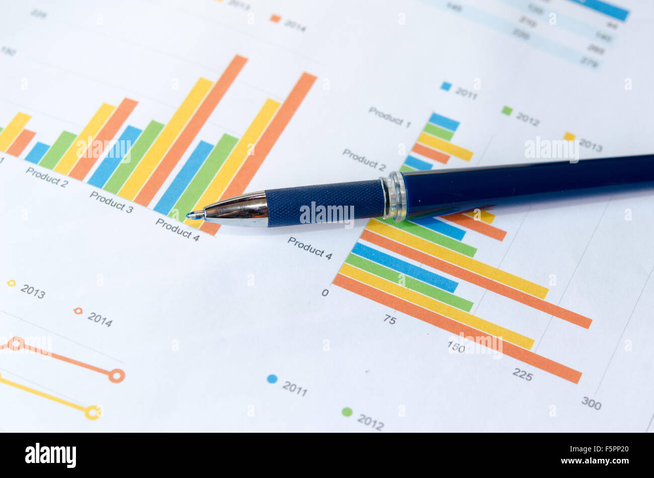 Financial graphs analysis and pen Stock Photo - Alamy