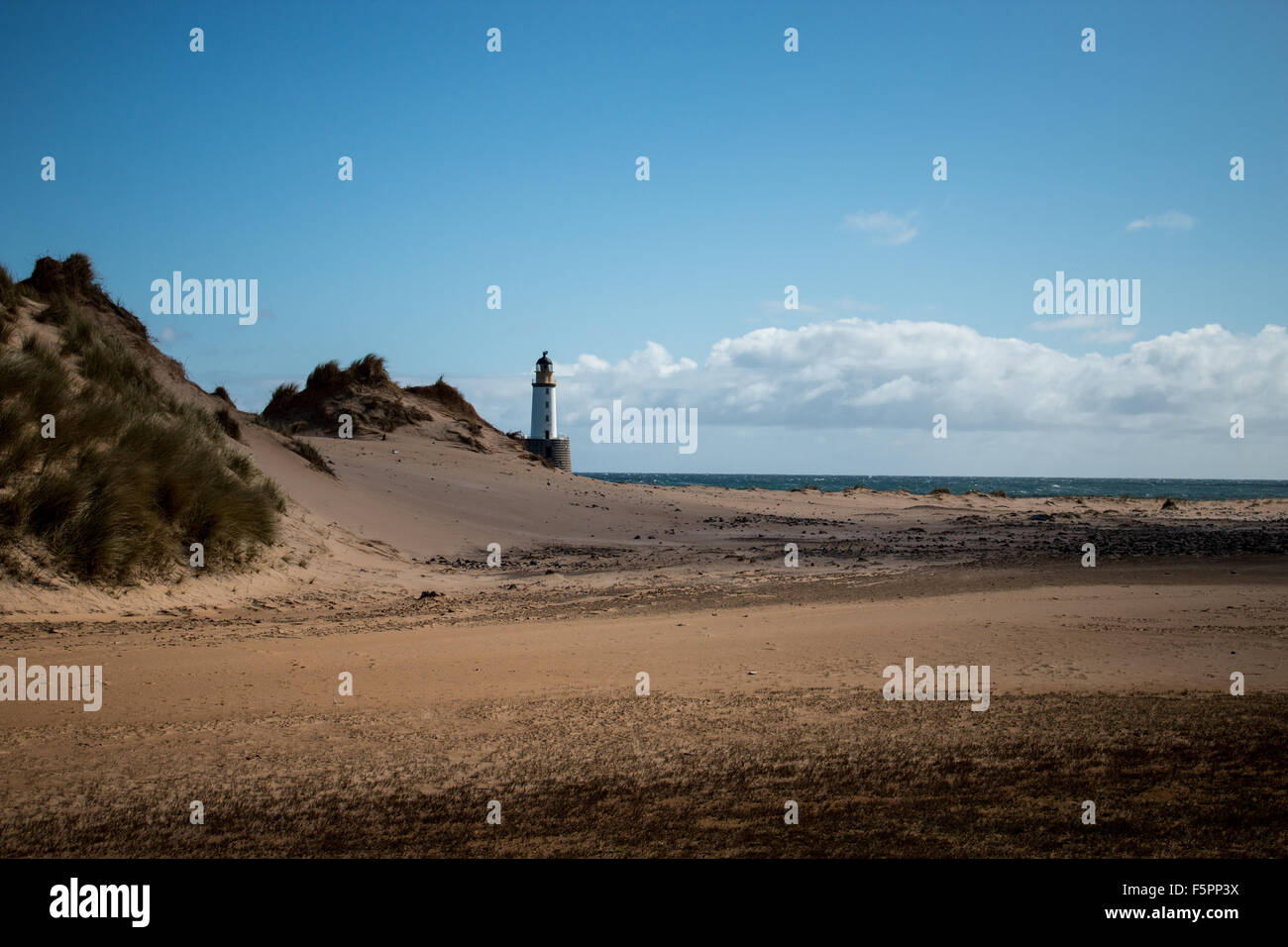 lighthouse and beach Stock Photo - Alamy