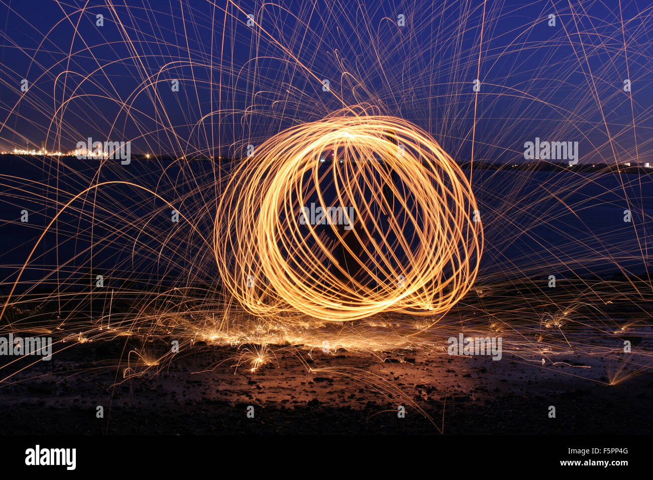 Spinning ball of fire Stock Photo - Alamy