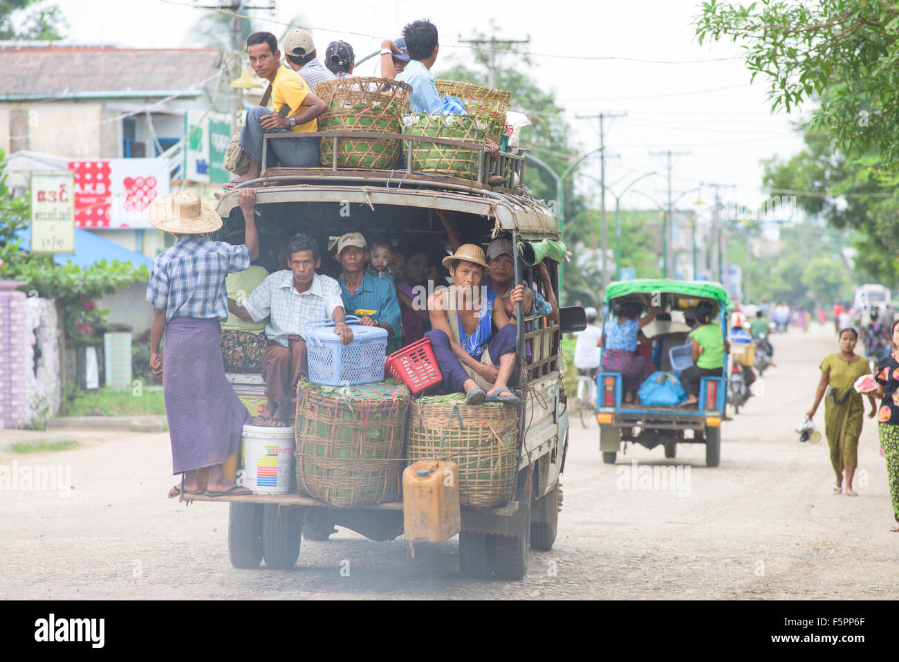Farmers arriving on passenger bus in Labutta Township, Ayeyarwady ...