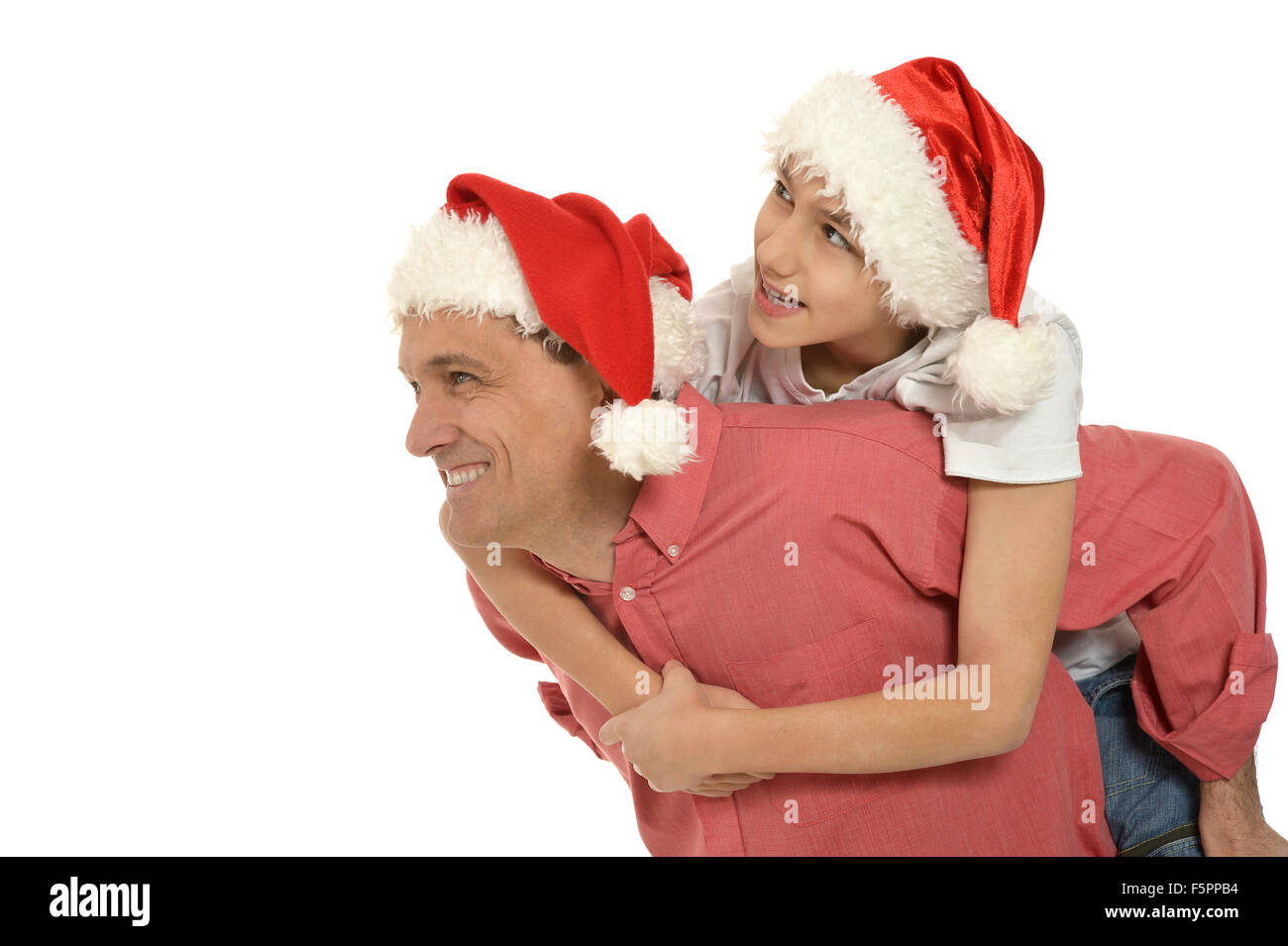 father with son wearing Christmas caps Stock Photo - Alamy