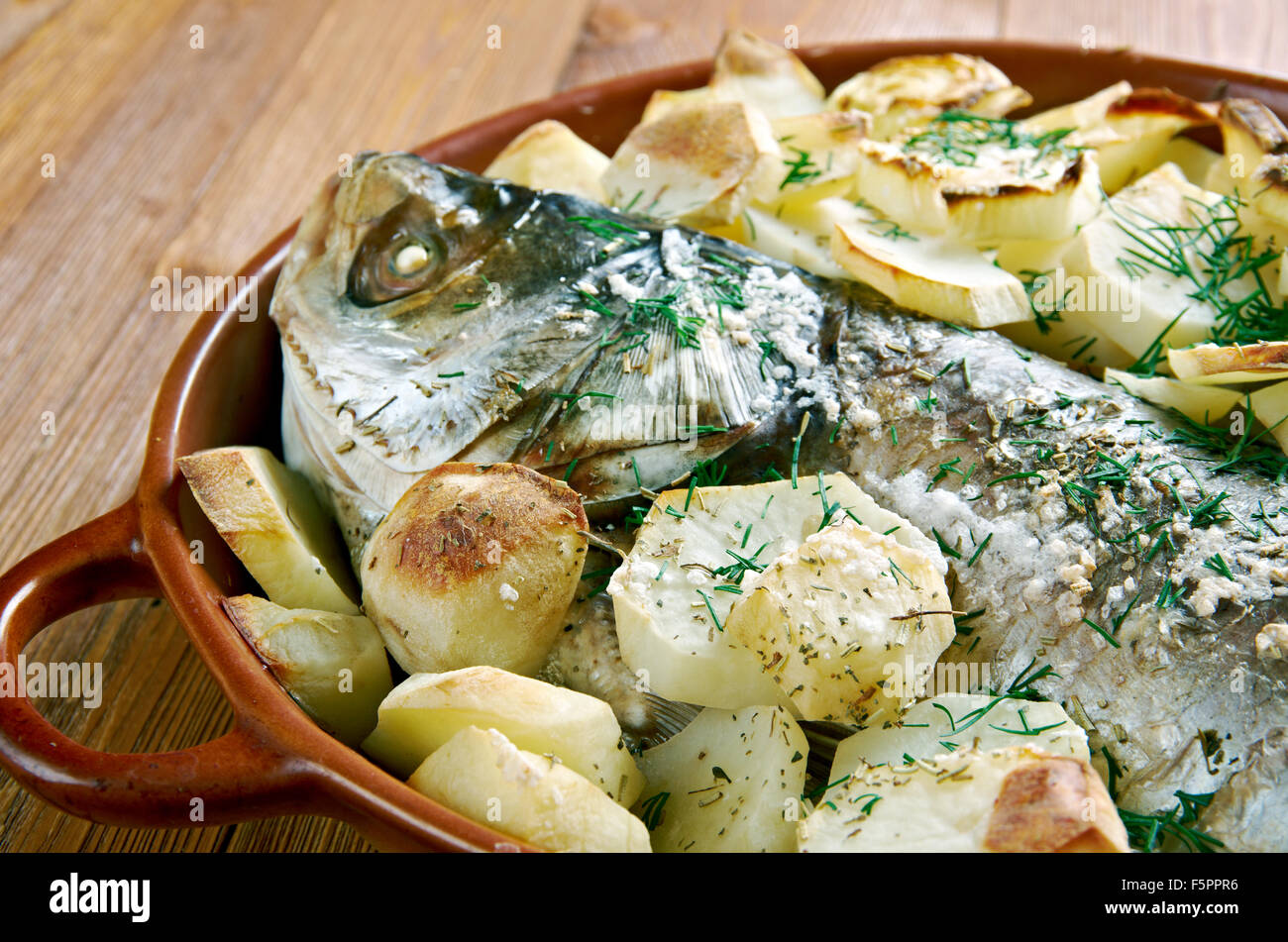 Psari sto fourno.baked fish. Cypriot cuisine Stock Photo - Alamy