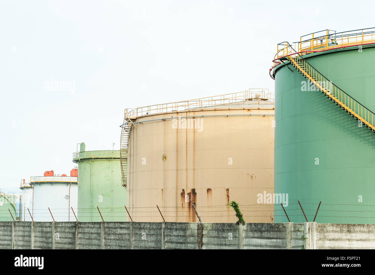 Industrial Storage Tanks. Oil tanks in line Stock Photo - Alamy