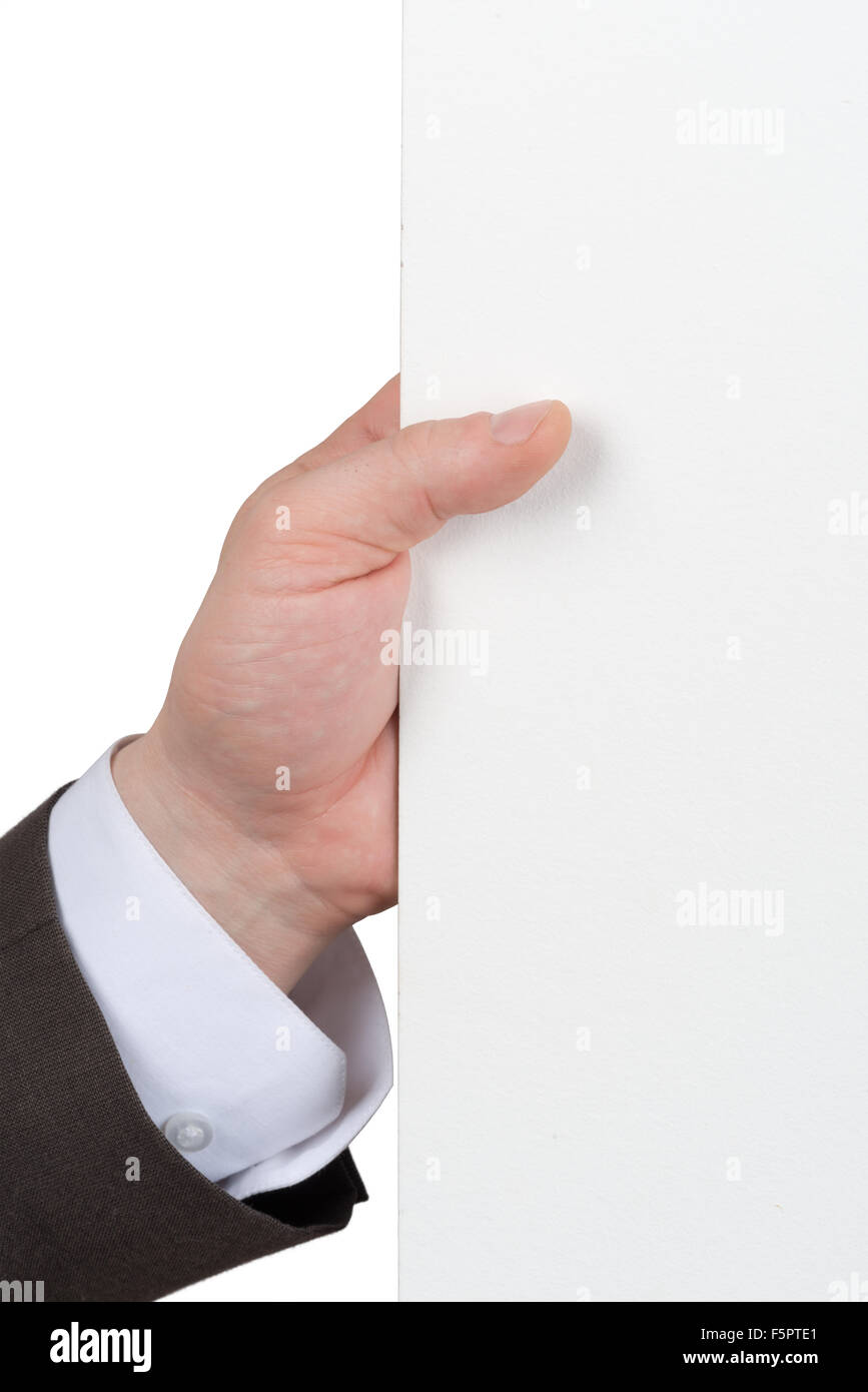 Businessman holding edge of blank paper Stock Photo - Alamy