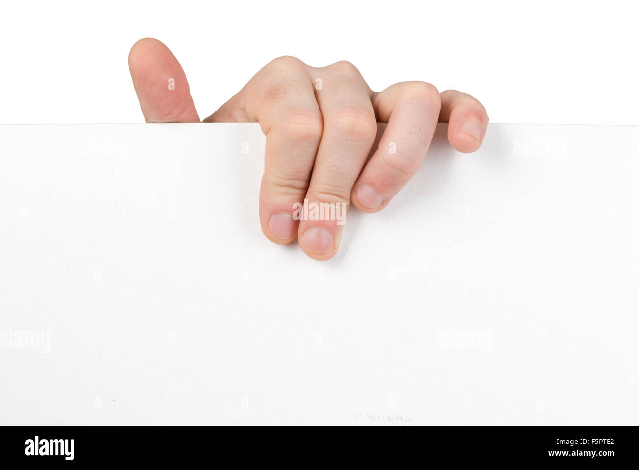 Businessman holding edge of empty paper Stock Photo - Alamy