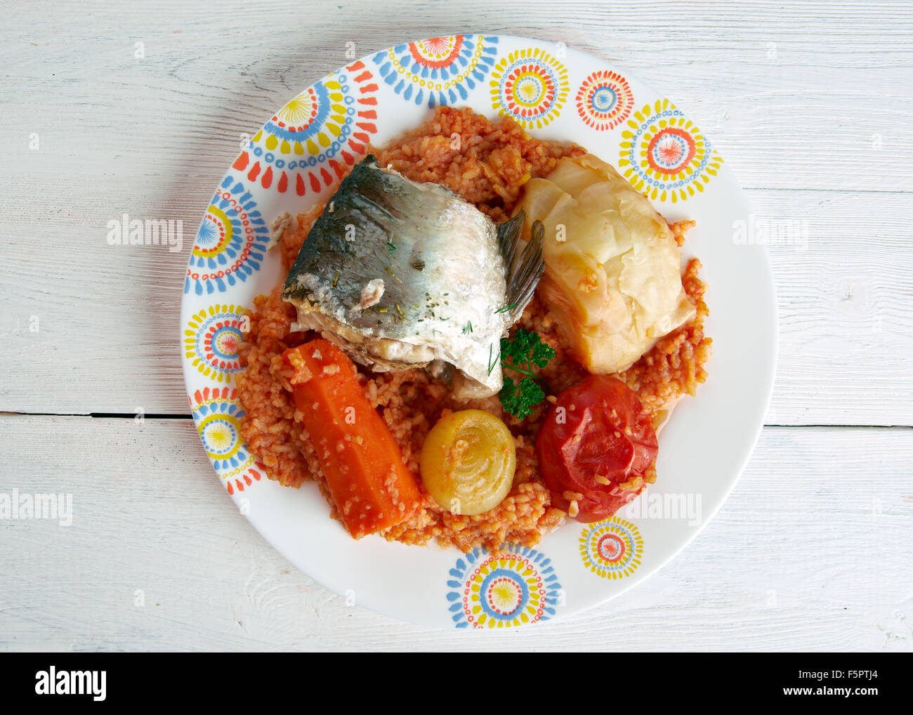 Thieboudienne - traditional dish from Senegal.made from fish, rice and ...